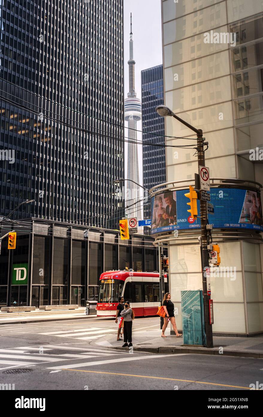 TORONTO, CANADA - 06 05 2021: Pedestrians and streetcar in front of ...