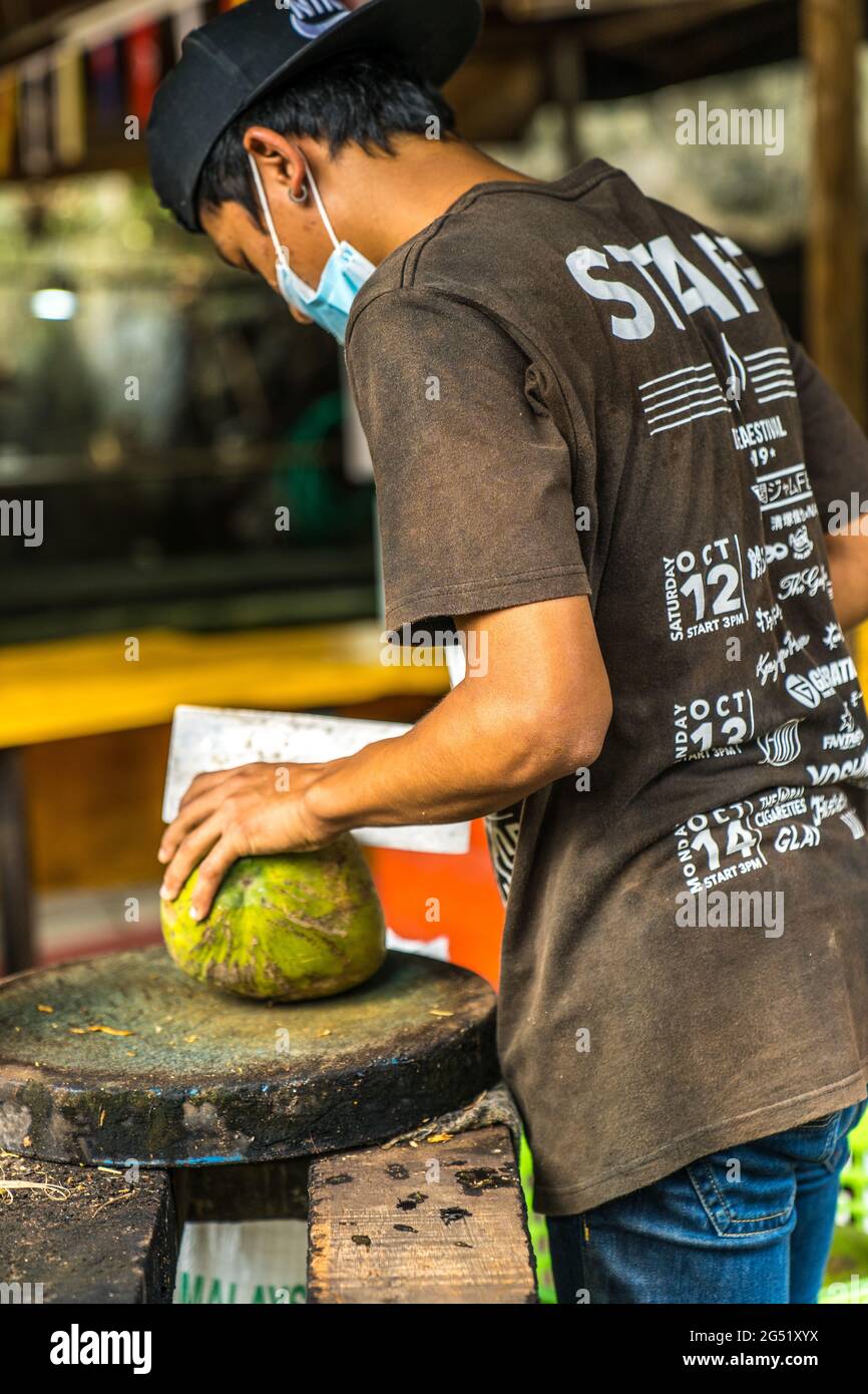 Opening a fresh coconut hi-res stock photography and images - Alamy