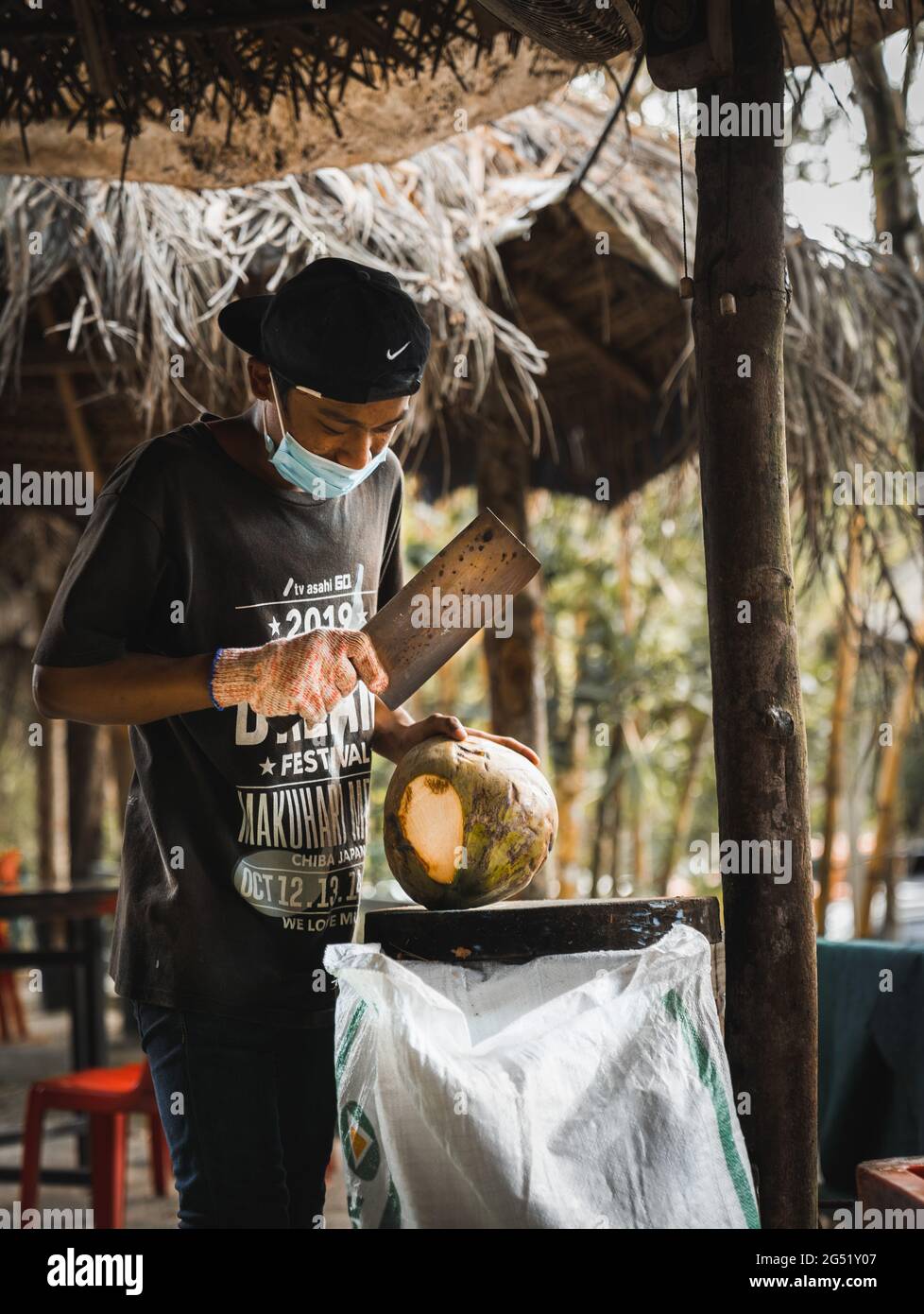 Opening a fresh coconut hi-res stock photography and images - Alamy