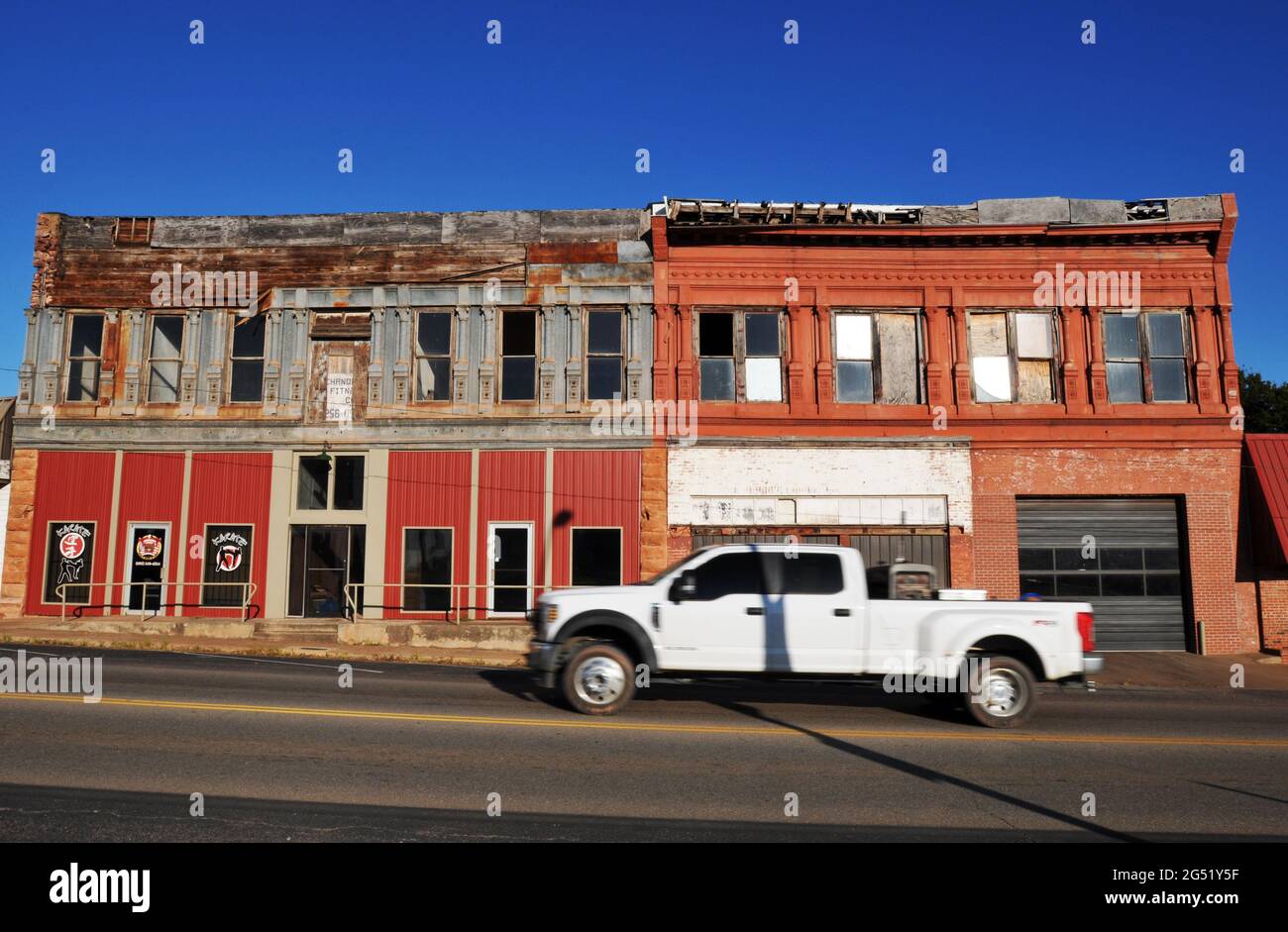 A pickup truck drives along Route 66 past the former St. Cloud Hotel in ...
