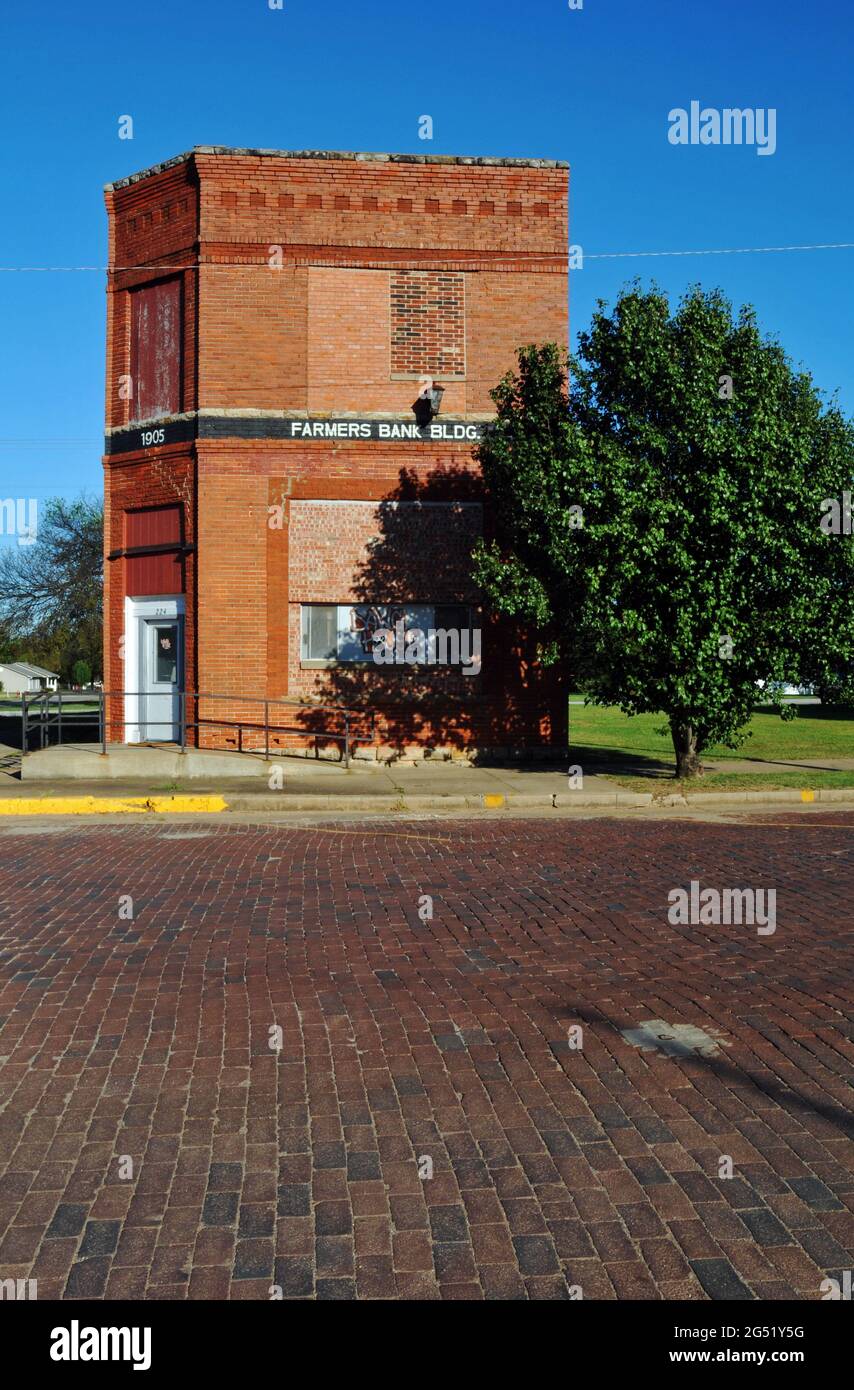 The 1905 Farmers Bank building stands along the red brick-paved ...