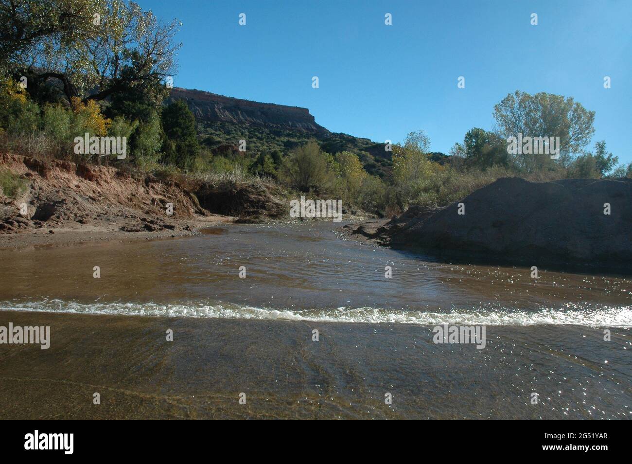 Driving through shallow flood water across road in Palo Duro Canyon ...