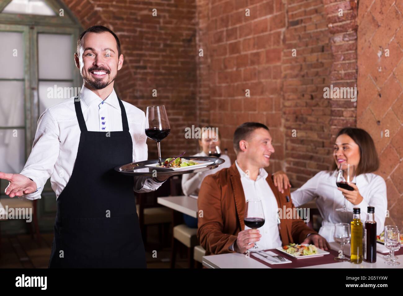 Male waiter in country restaurant Stock Photo - Alamy