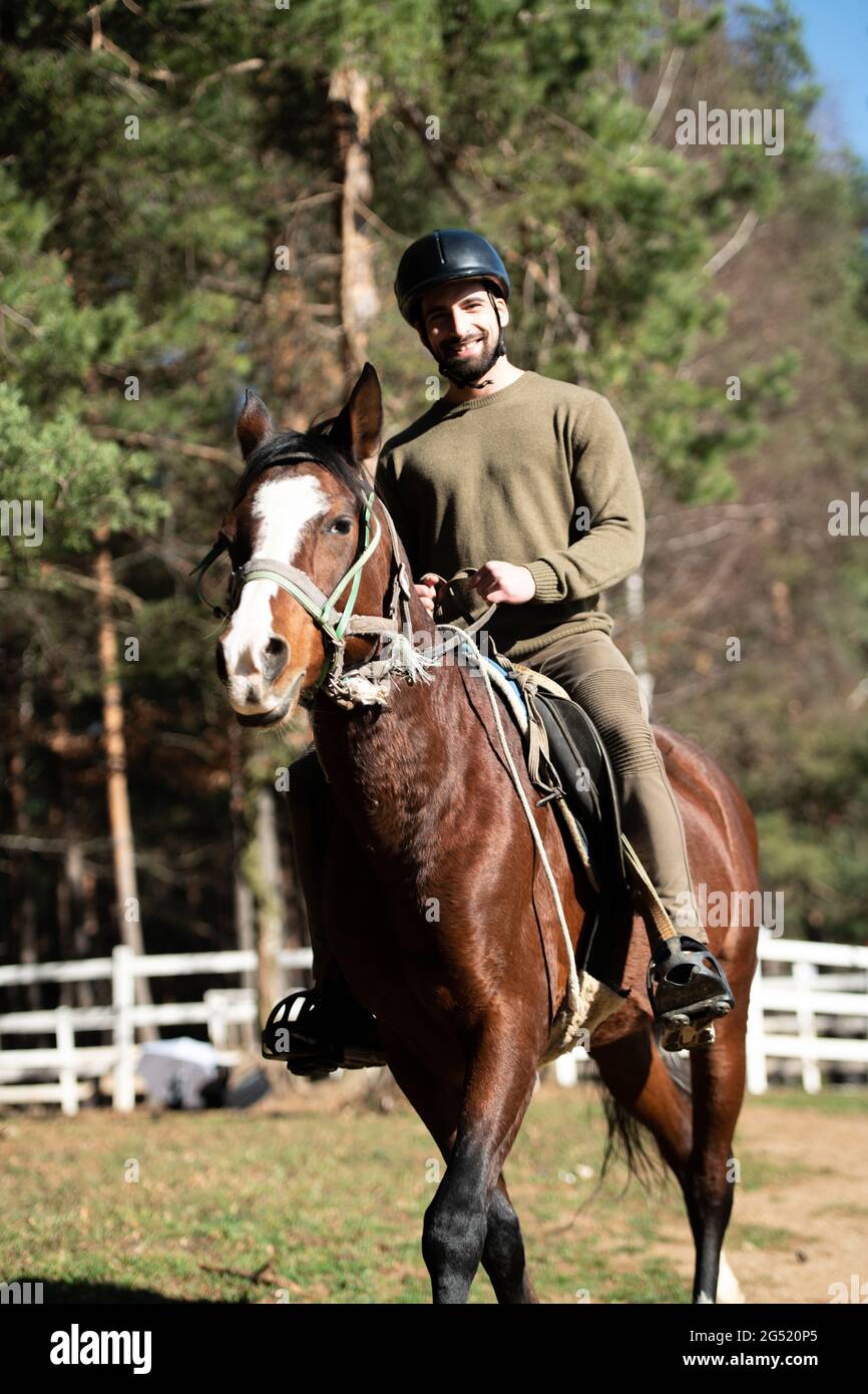 Young Man Rider With Her Horse Enjoying Good Mood in Evening Sunset ...