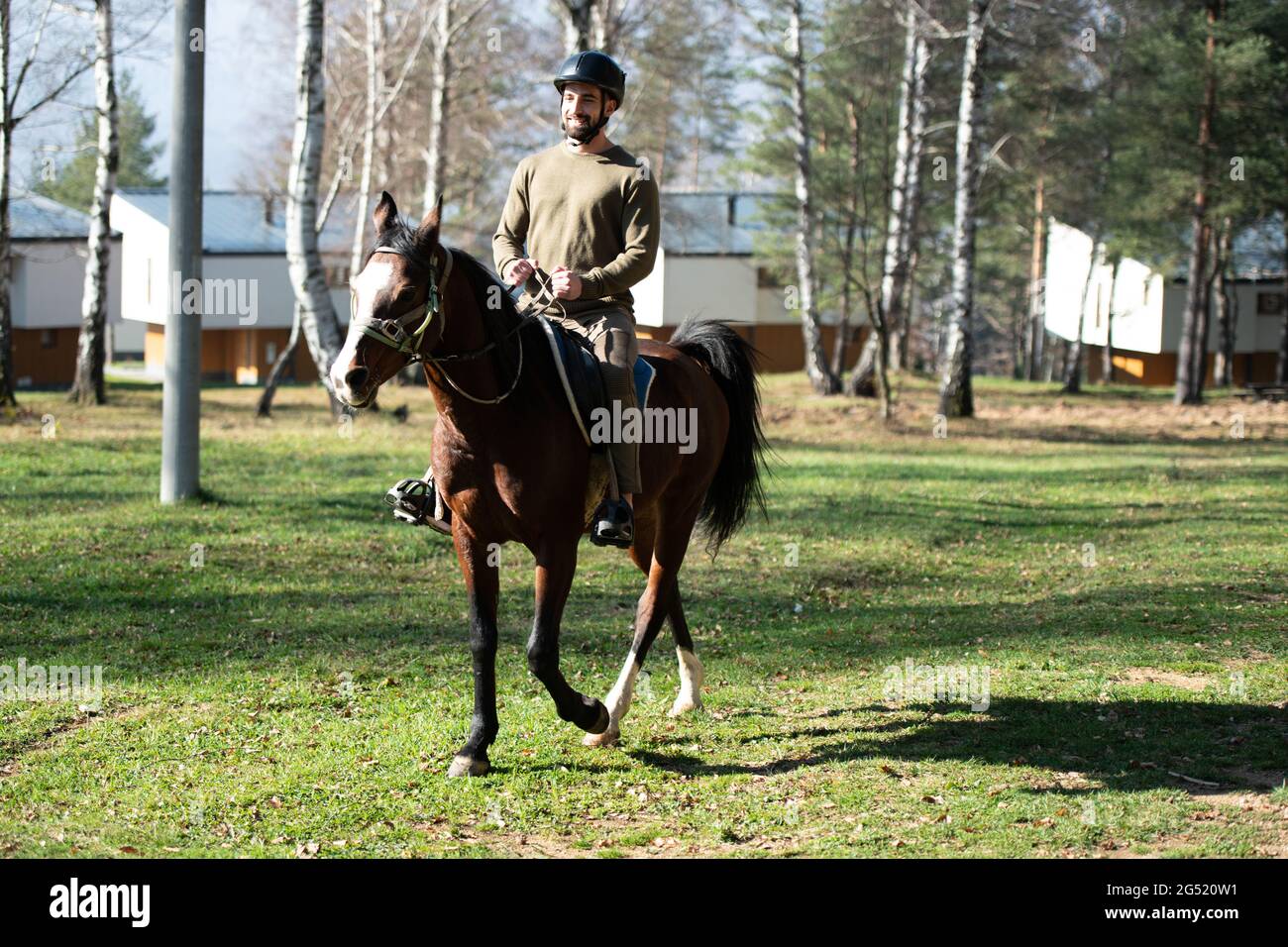 Young Man Rider With Her Horse Enjoying Good Mood in Evening Sunset ...