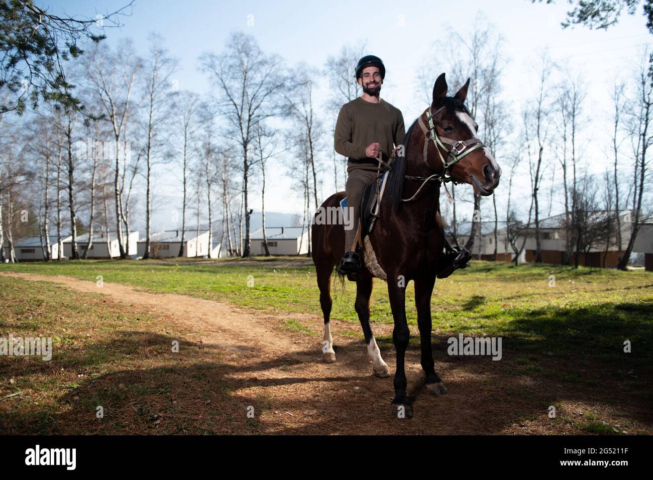 Young Man Rider With Her Horse Enjoying Good Mood in Evening Sunset ...