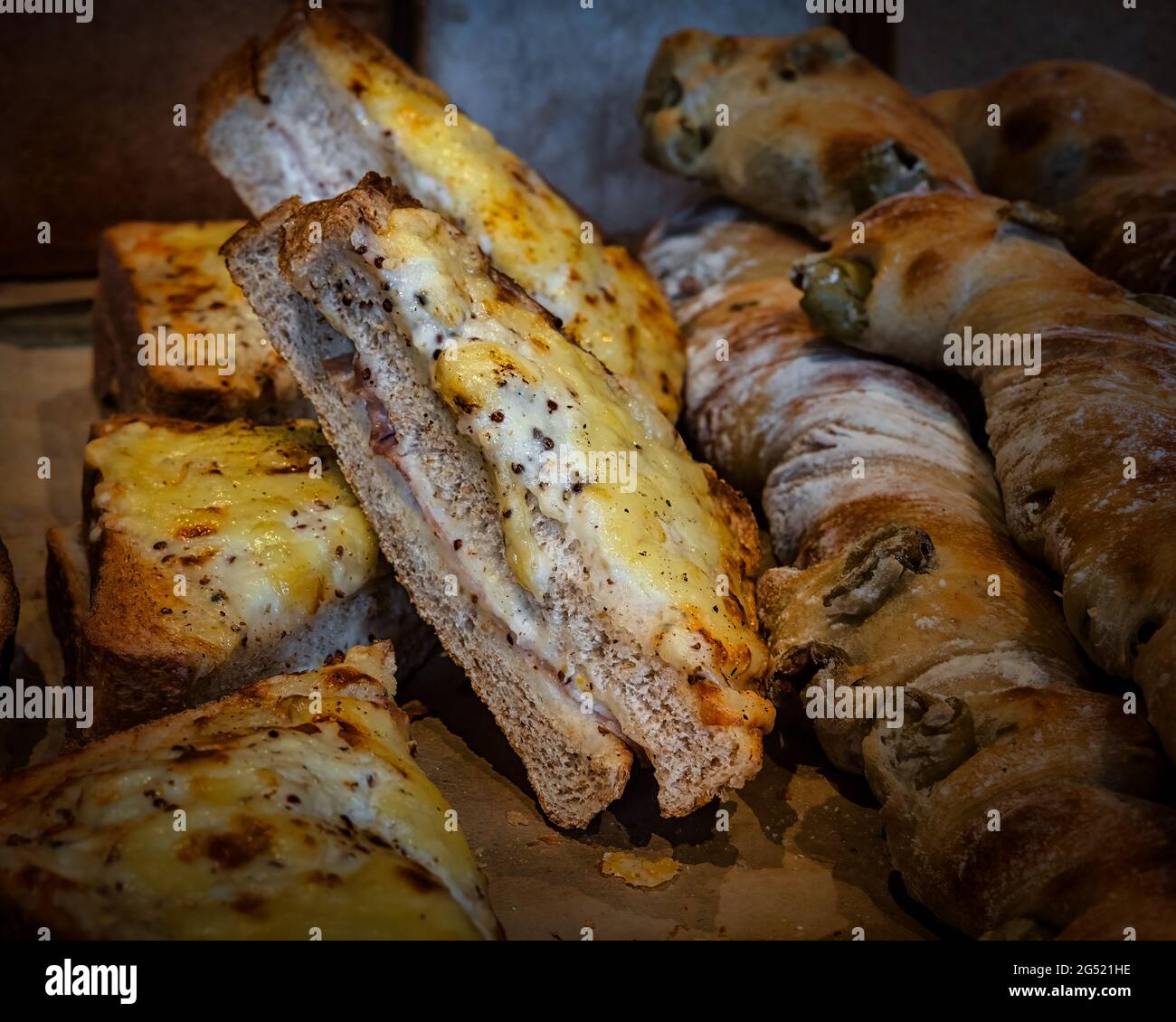 Sandwiches covered with cheese in a bakery in Tokyo, Japan Stock Photo ...