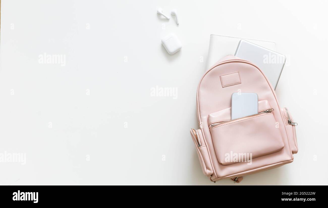 Top view elegant pink student backpack full of supplies isolated. Back ...