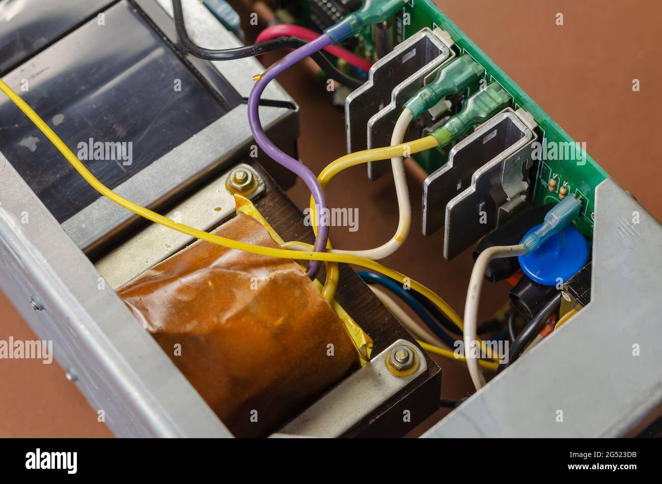 E-waste recycling concept. Old device with transformer and wires ...