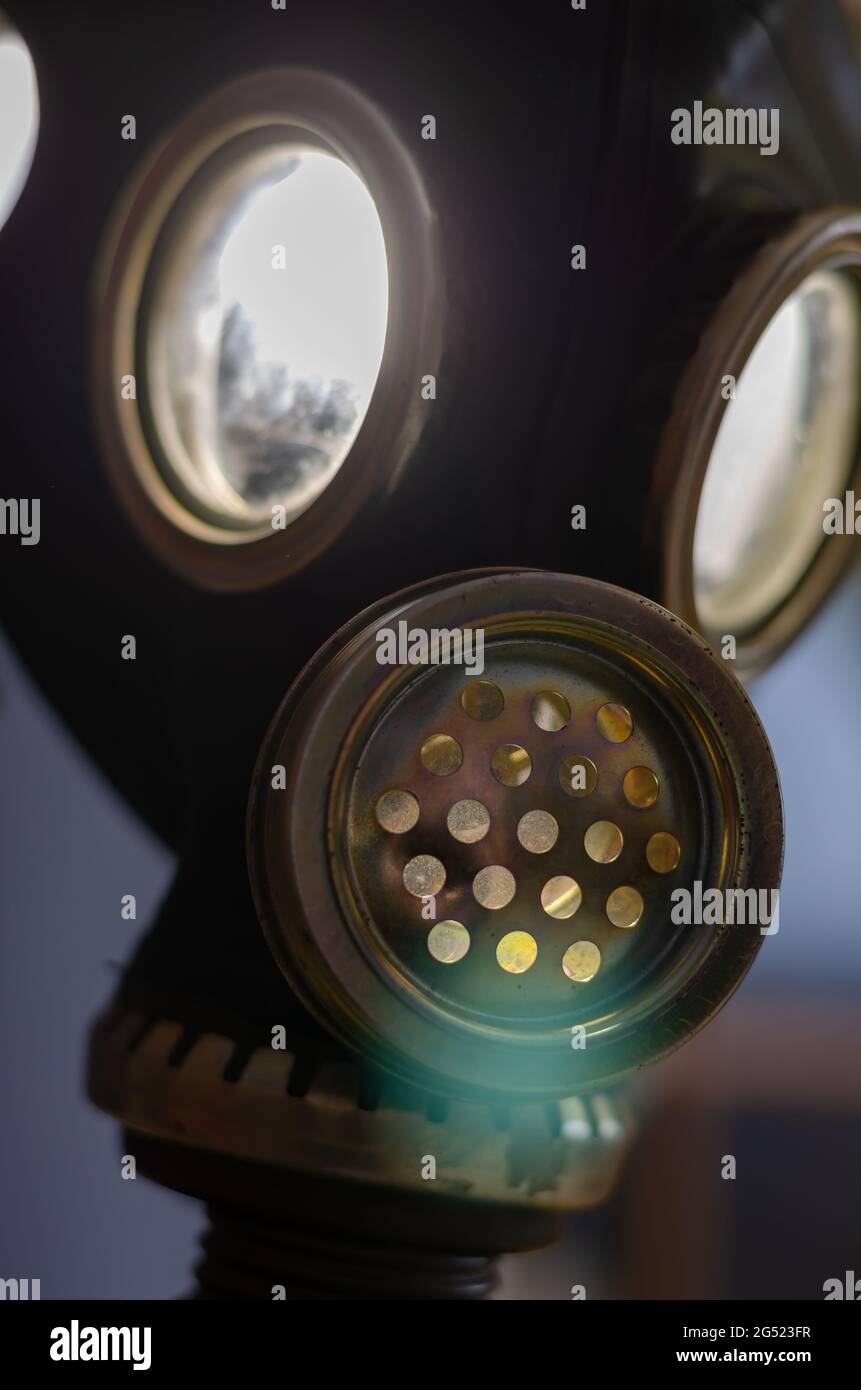 Abstract composition with a gas mask glowing from inside. Military gas ...