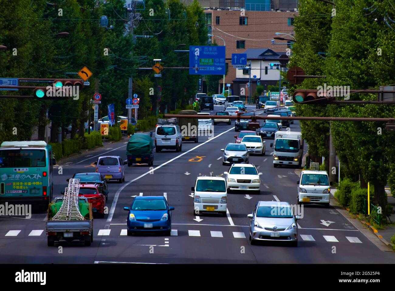 A downtown street at Oume avenue in Tokyo daytime long shot Stock Photo ...