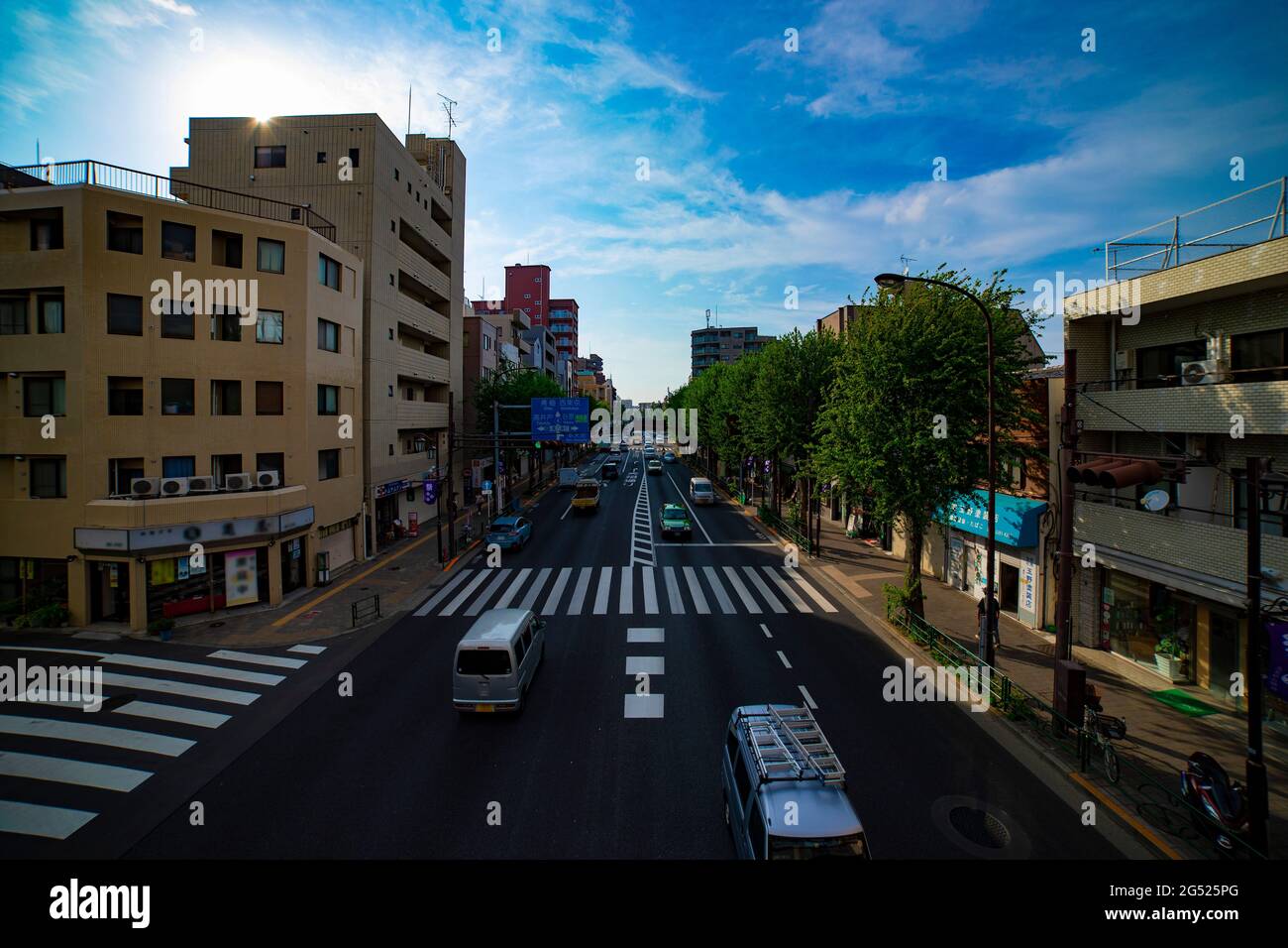 A downtown street at Oume avenue in Tokyo daytime wide shot Stock Photo ...