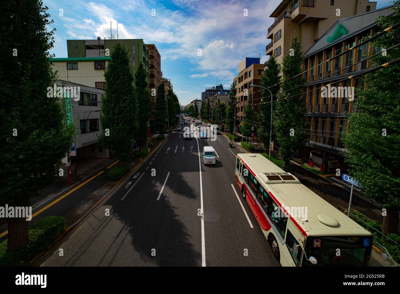 A downtown street at Oume avenue in Tokyo daytime wide shot Stock Photo ...