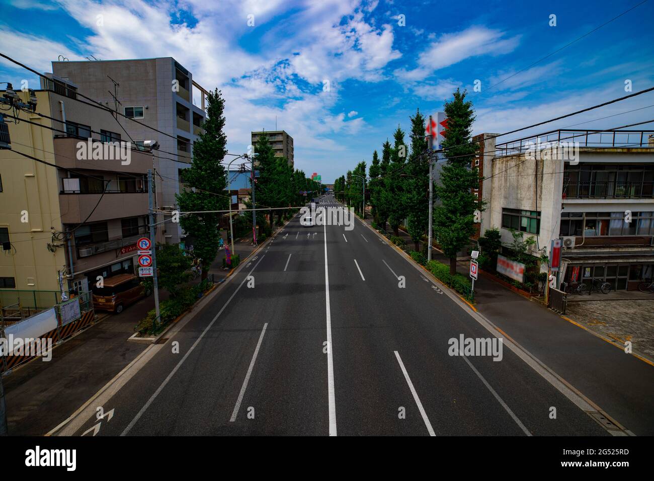 A downtown street at Oume avenue in Tokyo daytime wide shot Stock Photo ...