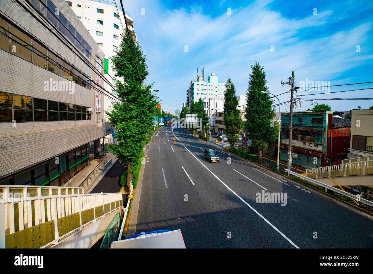 A downtown street at Oume avenue in Tokyo daytime wide shot Stock Photo ...