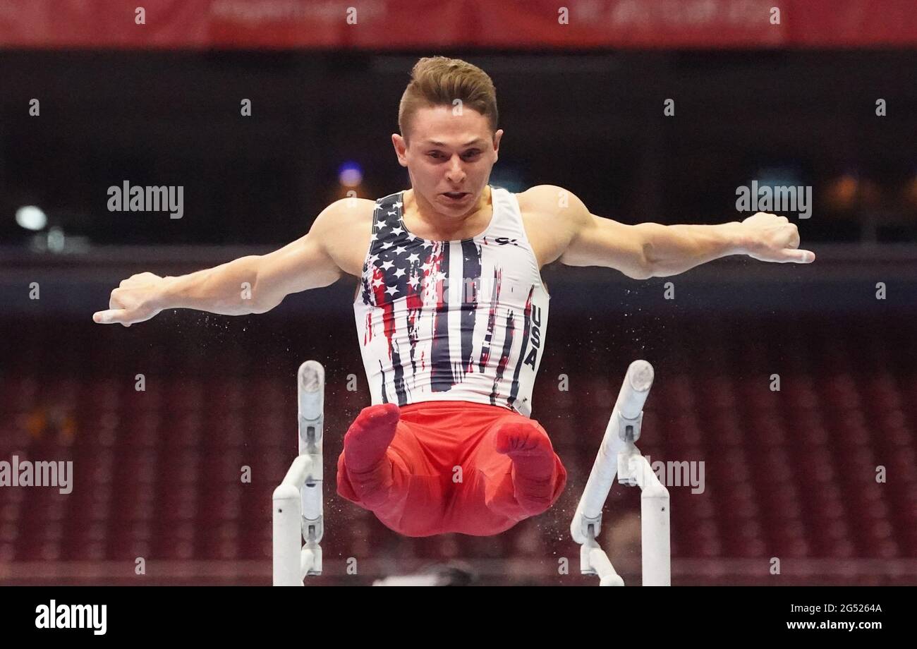 Paul Juda of the University of Michigan performs on the Parallel Bars ...