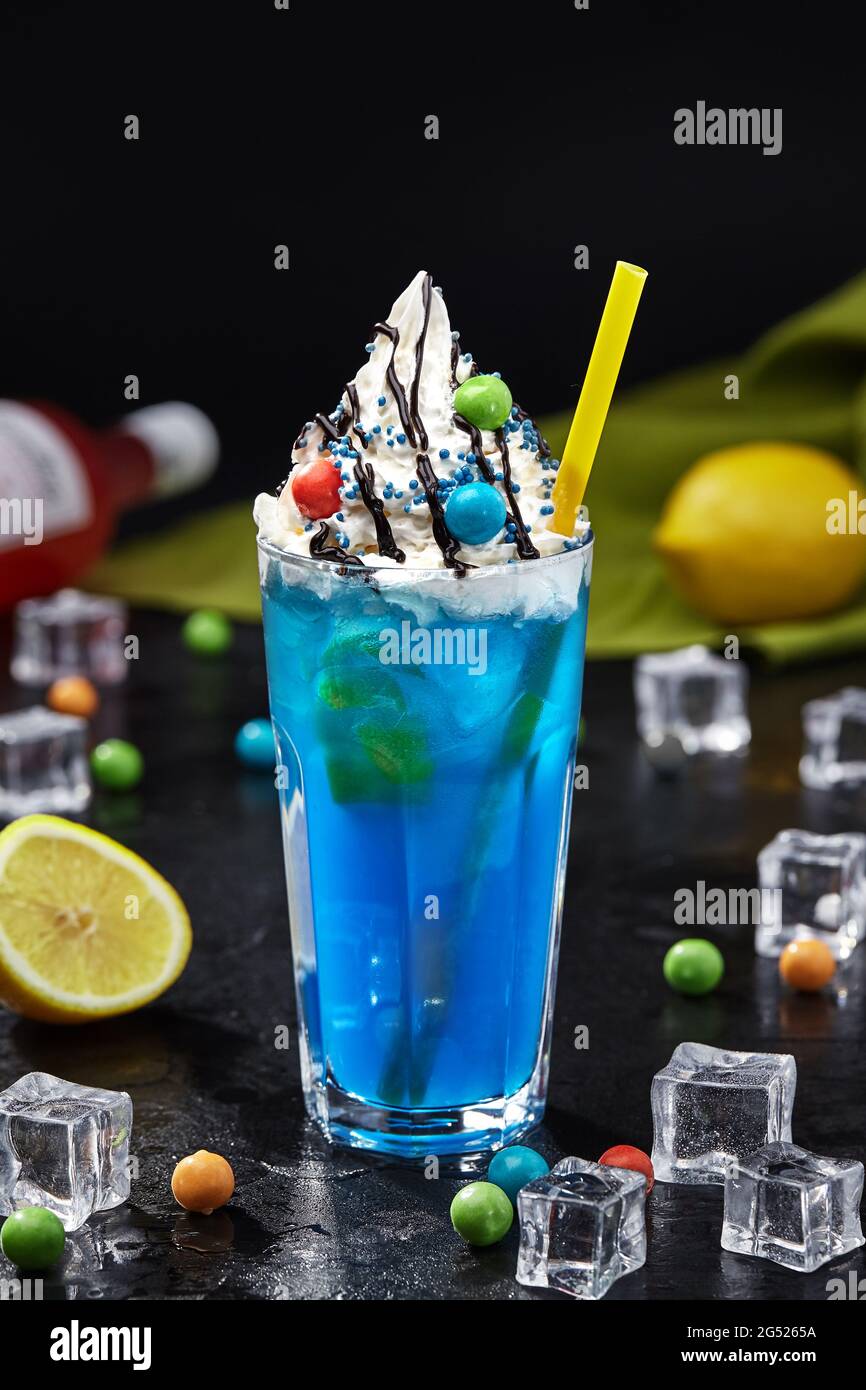 Blue lemonade with whipped cream topped and balls of chewing gum Stock ...