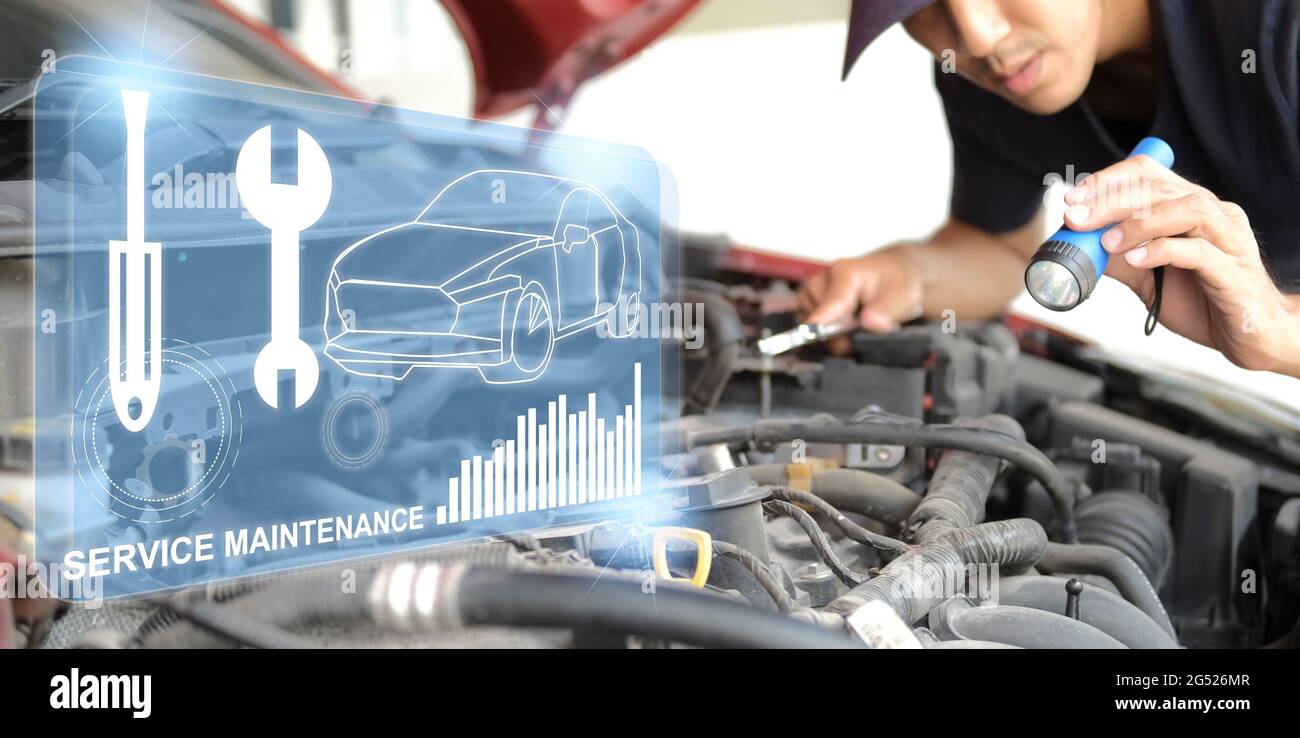 Asian Man mechanic inspection Shine a torch car engine checking bug in ...