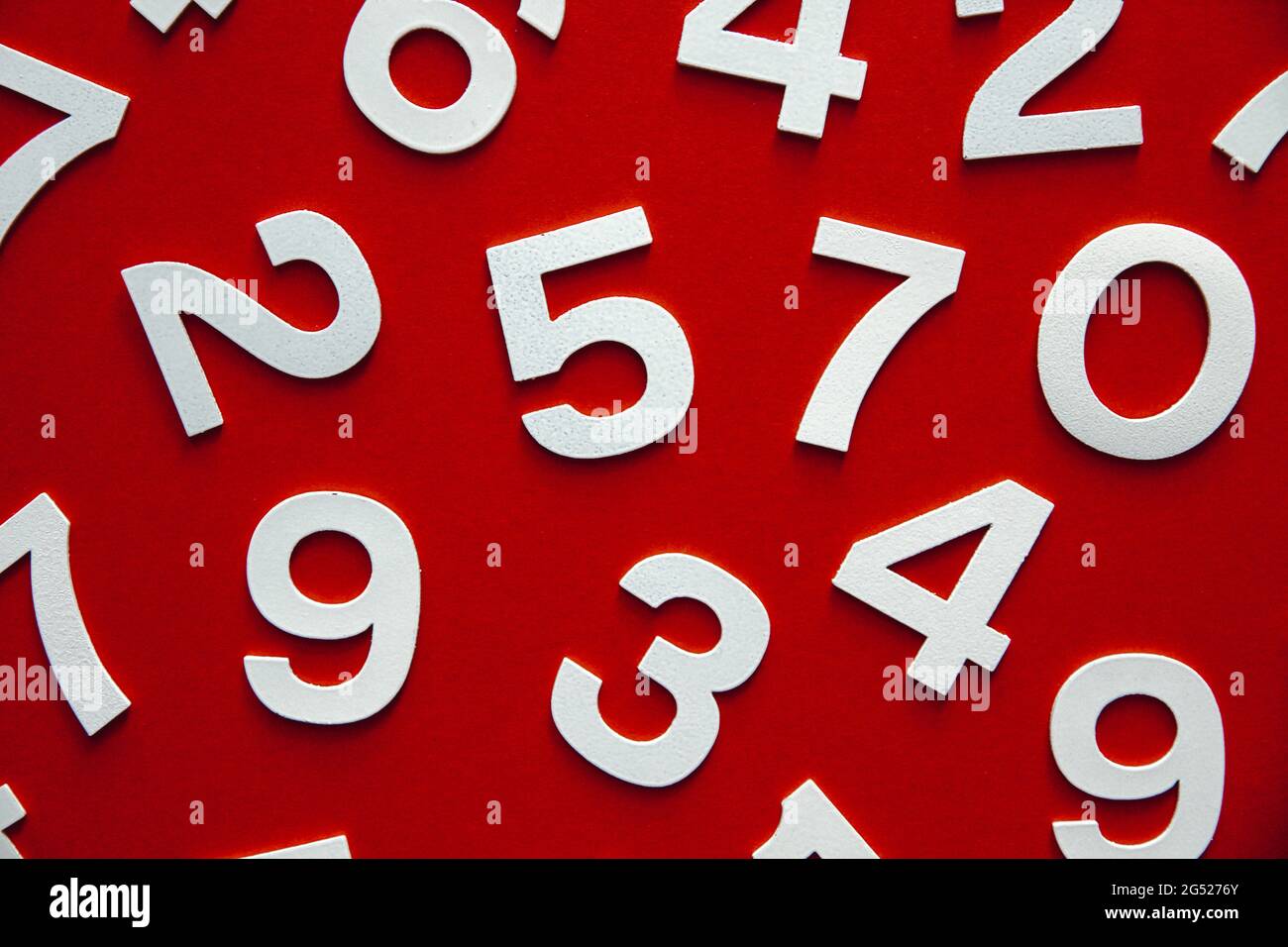 Mathematics background made with solid numbers on a board. Top view ...