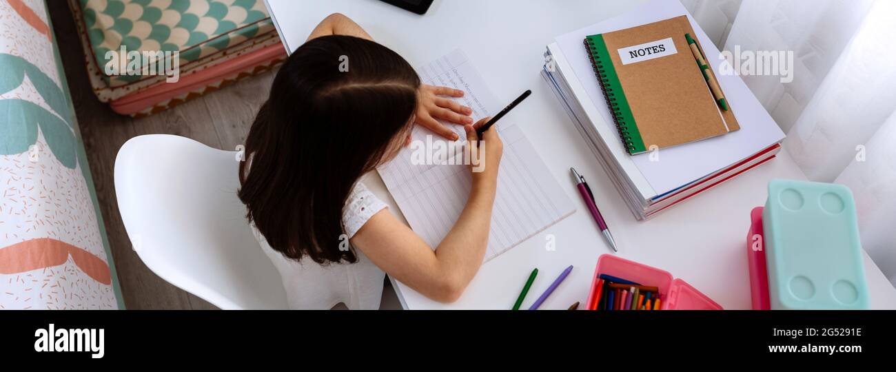 Girl doing homework in her bedroom Stock Photo - Alamy