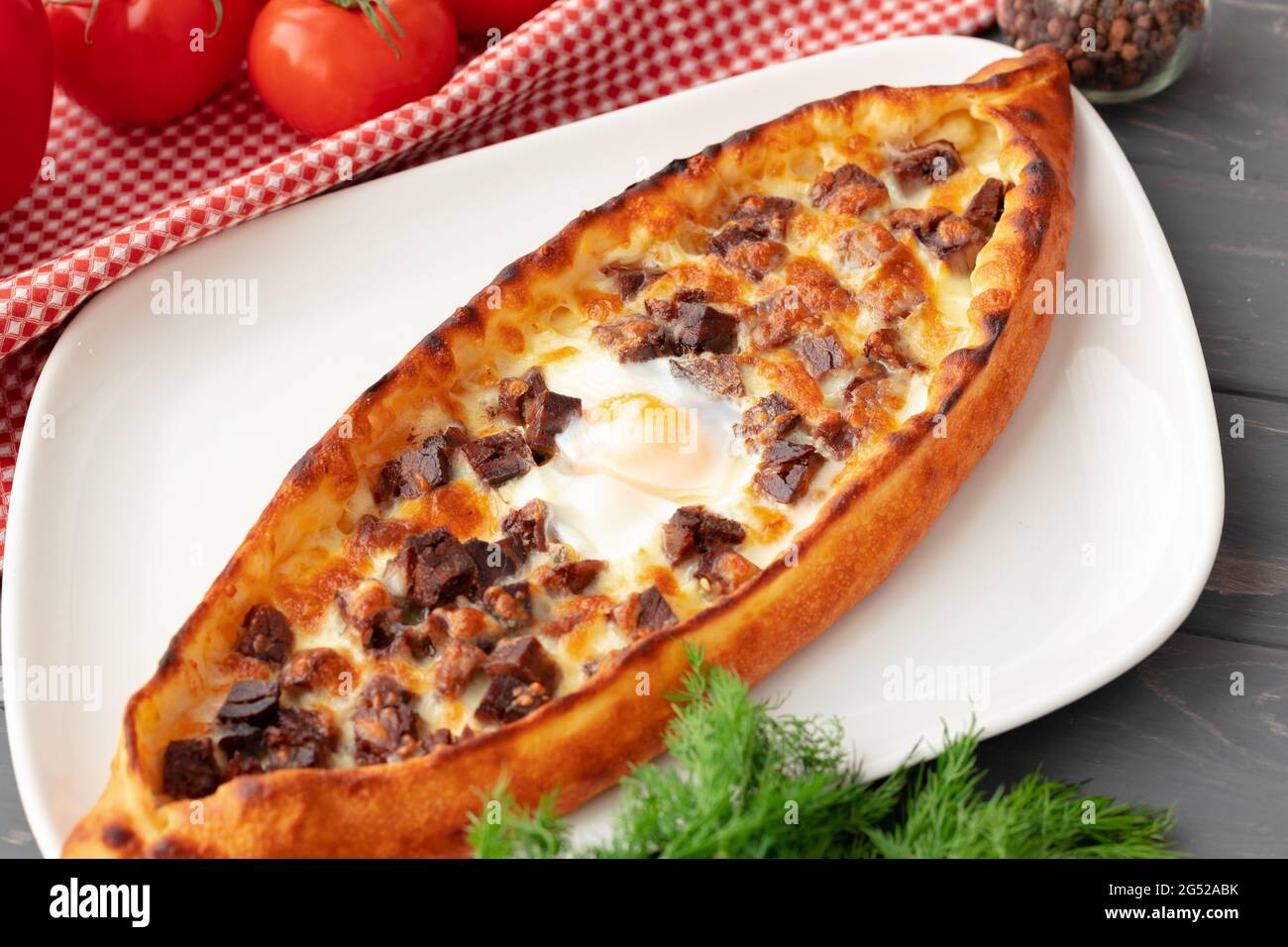 Close up of Turkish Pide bread on wooden table Stock Photo - Alamy