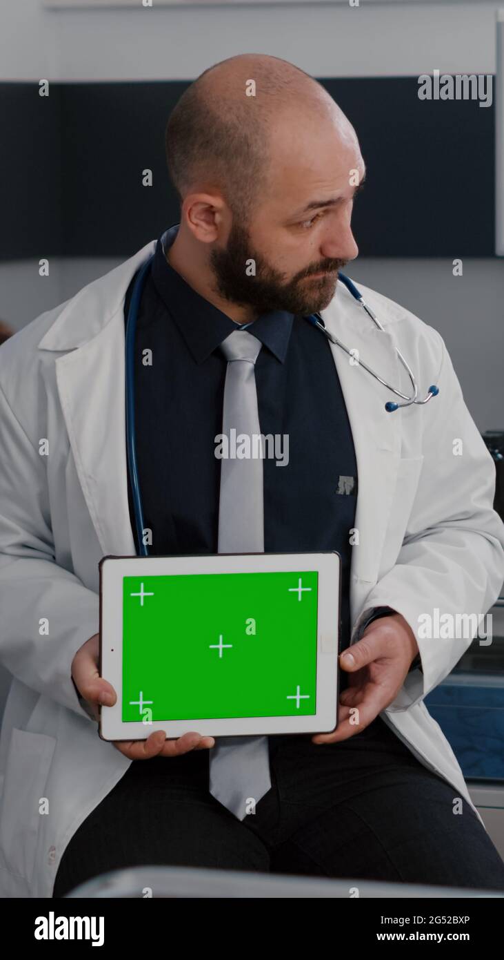 Specialist man in white coat talking with sick woman about illness ...