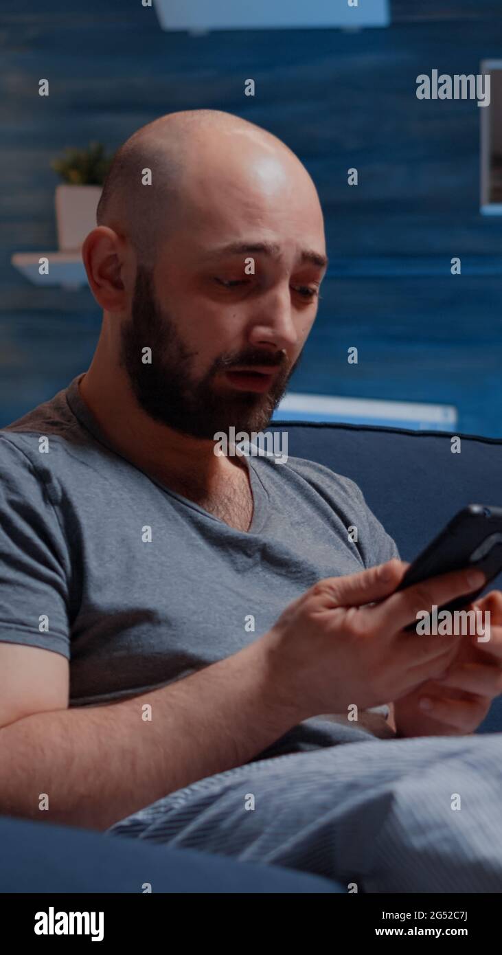 Desperate, depressed, helpless frustrated man reading digital banking ...