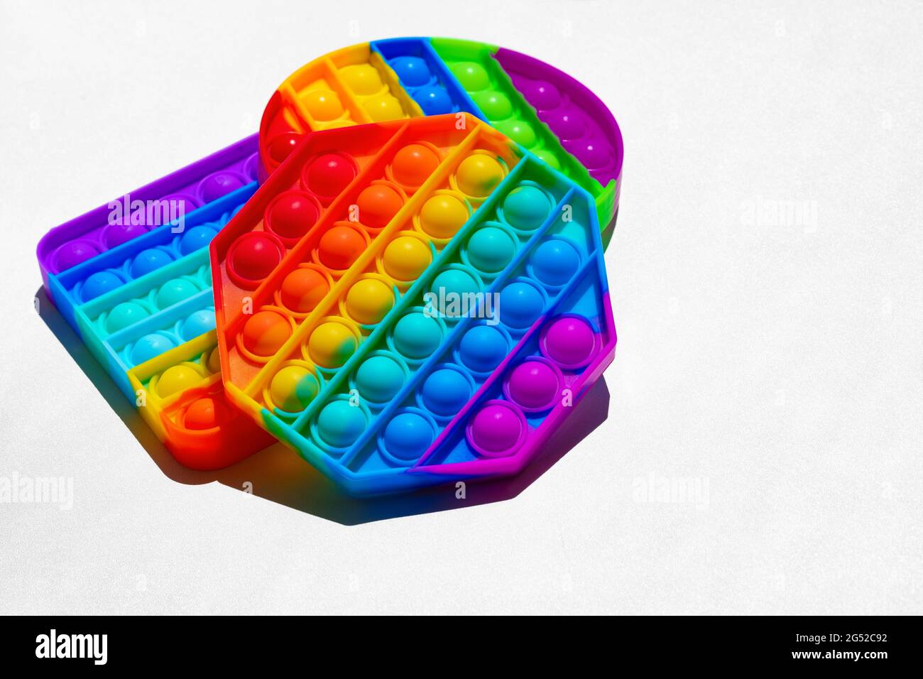 Colorful antistress pop it toy on white background Stock Photo - Alamy
