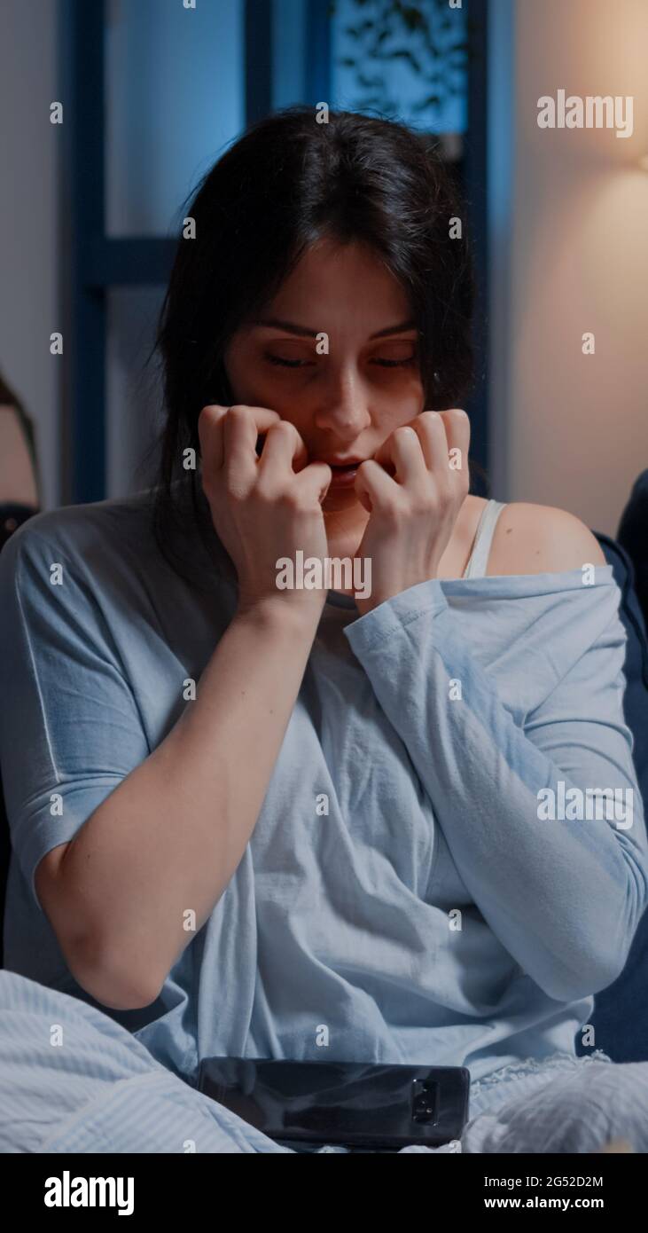 Shocked face of young woman talking at smartphone, receving bad news ...