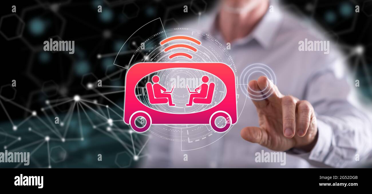 Man touching a self-driving car concept on a touch screen with his ...