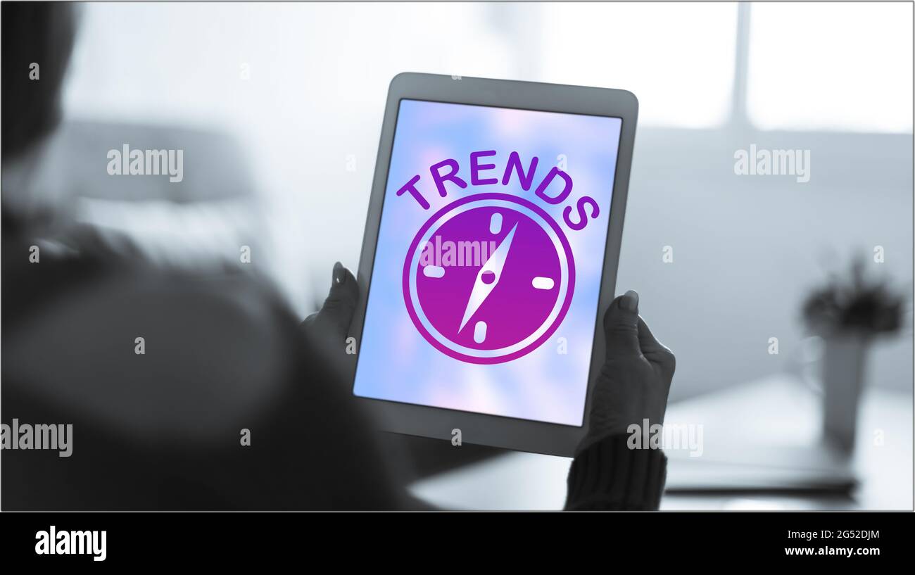 Tablet screen displaying trends hi-res stock photography and images - Alamy