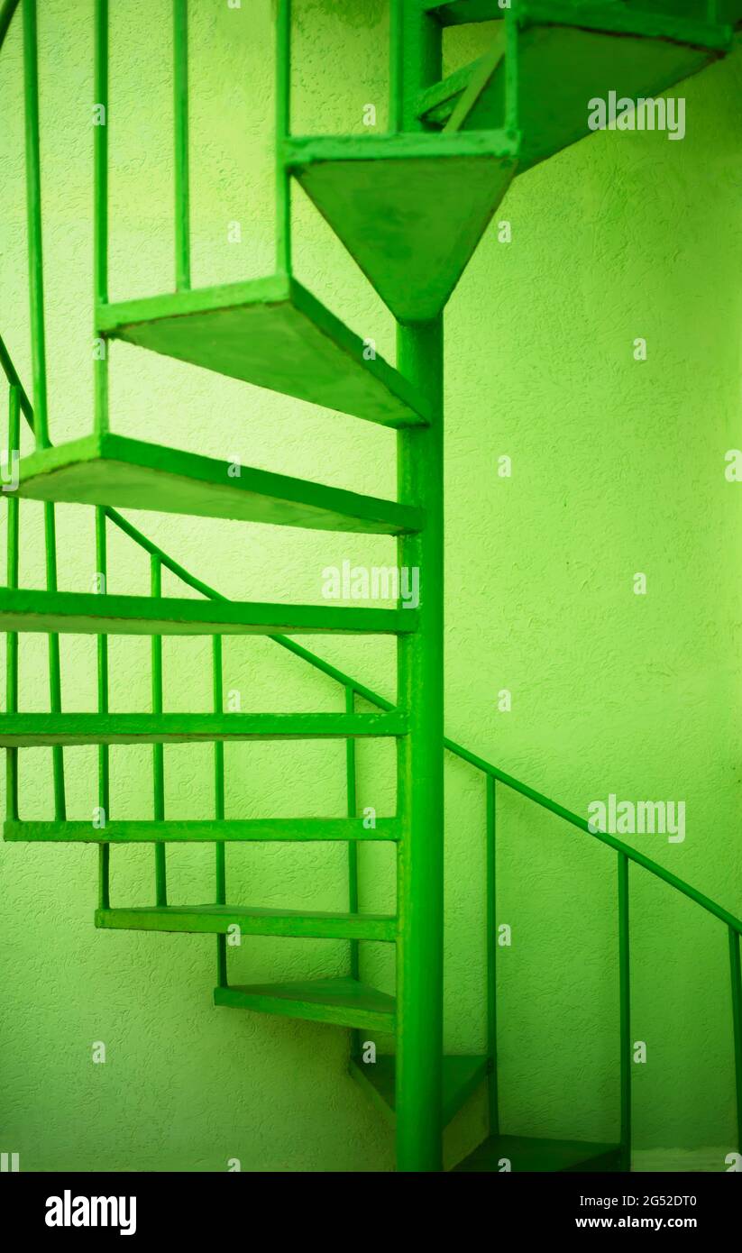 Green backgrounds. Futuristic spiral green staircase against the ...