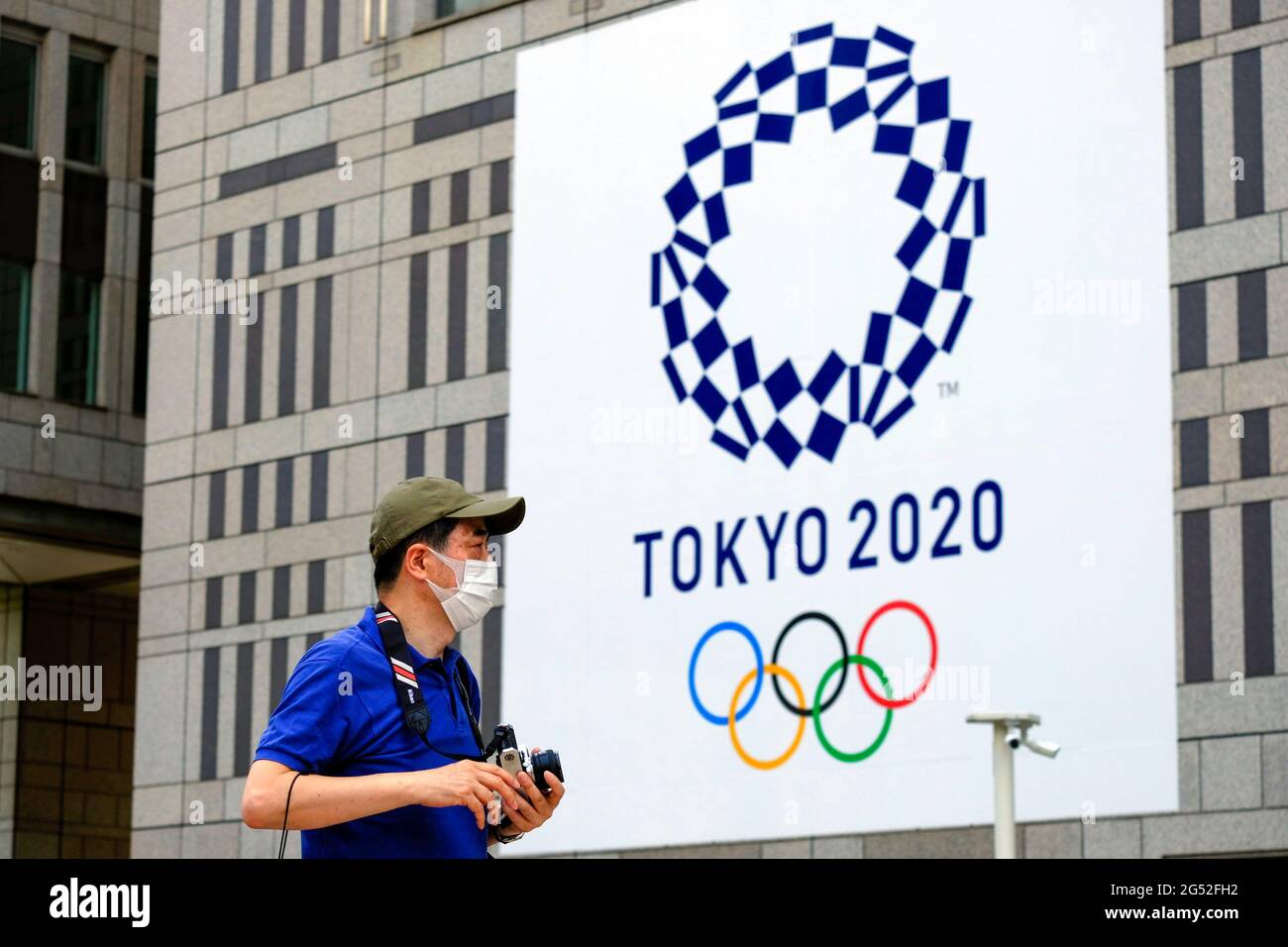 A man wearing a mask as a preventive measure against the spread of ...