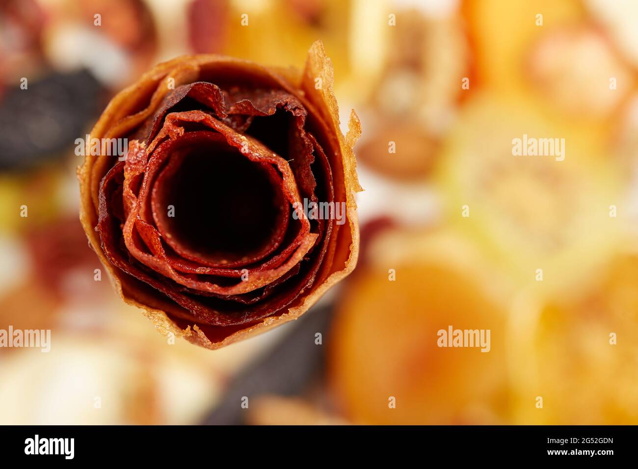 Close up of sweet pure fruit pastille in rolls and healthy sweets ...