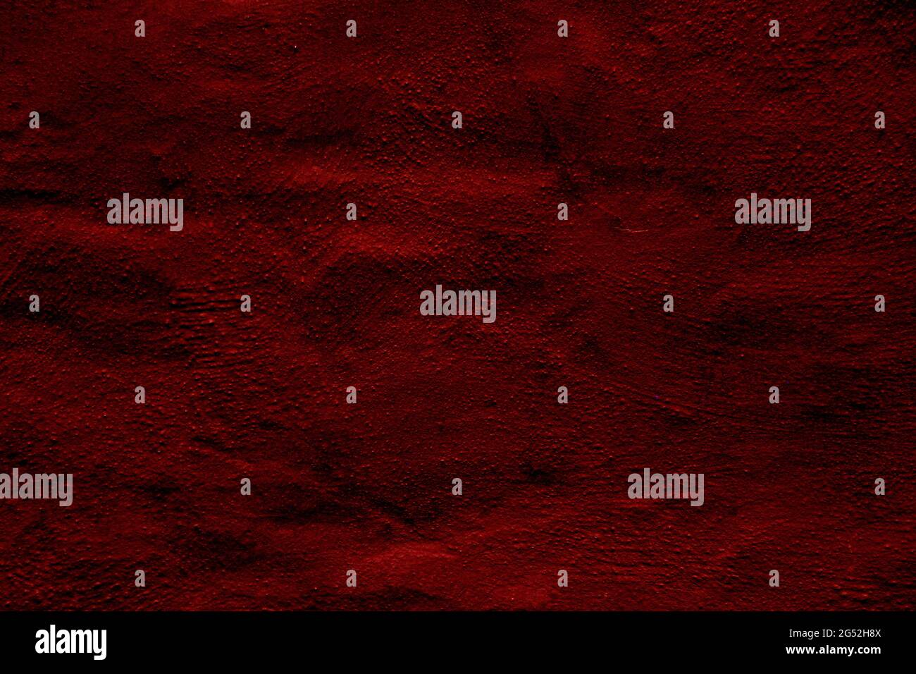 Crimson colored wall background with textures of different shades of ...