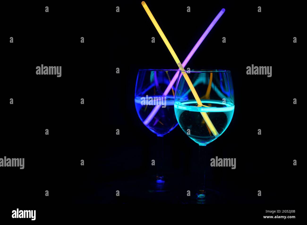 Multicolor mocktail wine glass filled with illuminated relaxing alcohol ...