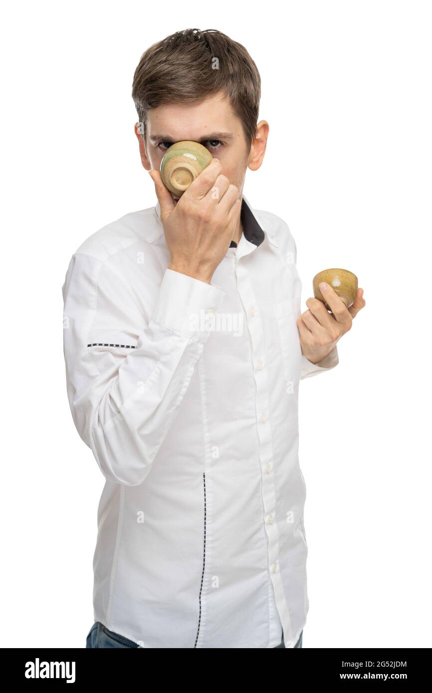 Young handsome tall slim white man with brown hair with tea cup at his ...