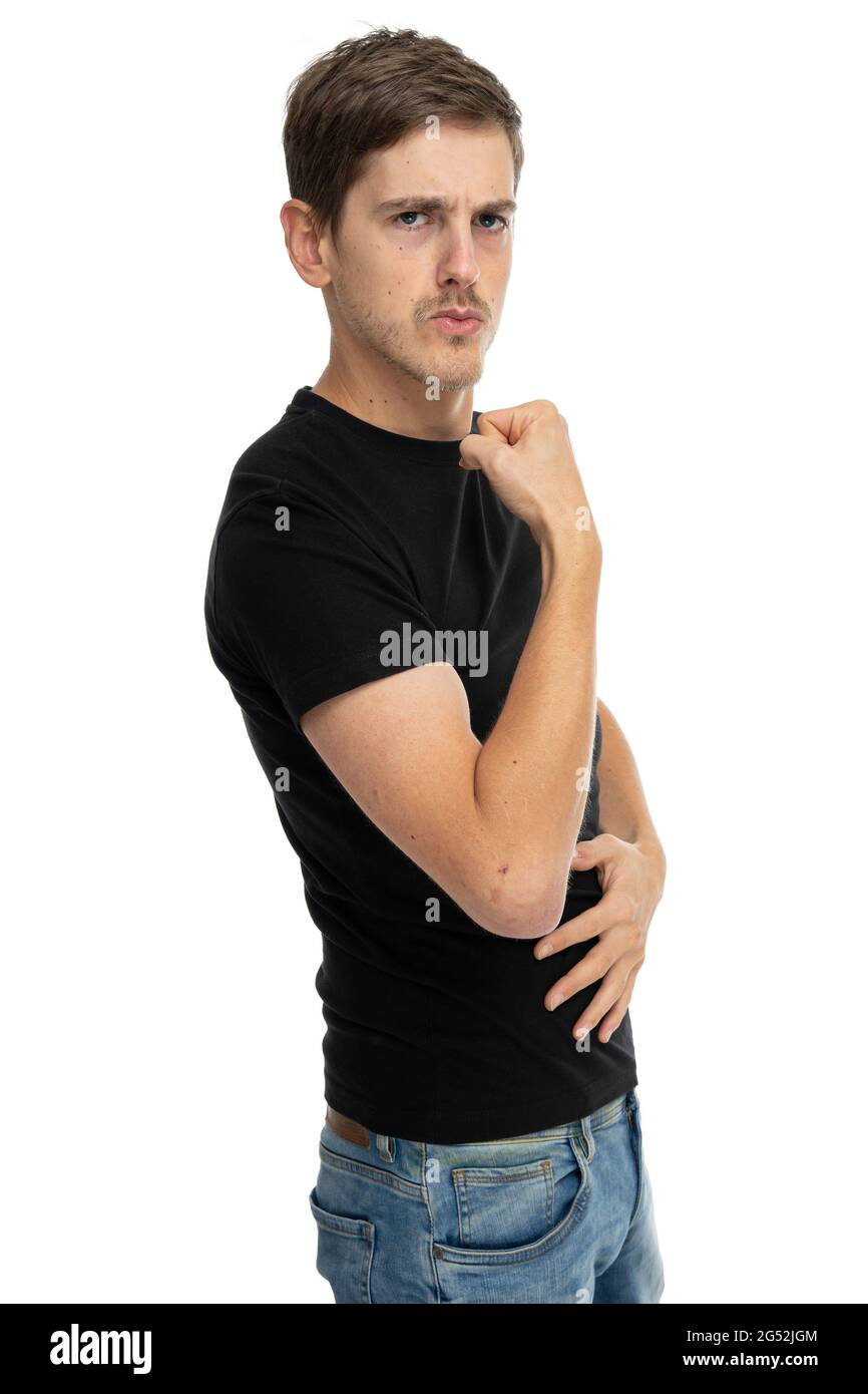 Young handsome tall slim white man with brown hair looks grumpy in ...