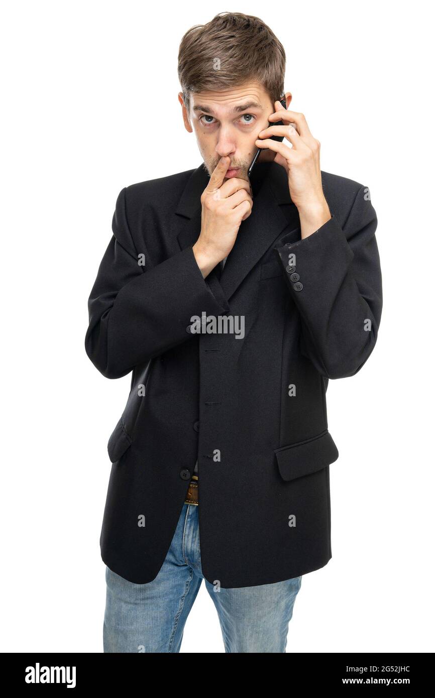 Confused man talking on mobile Cut Out Stock Images & Pictures - Alamy