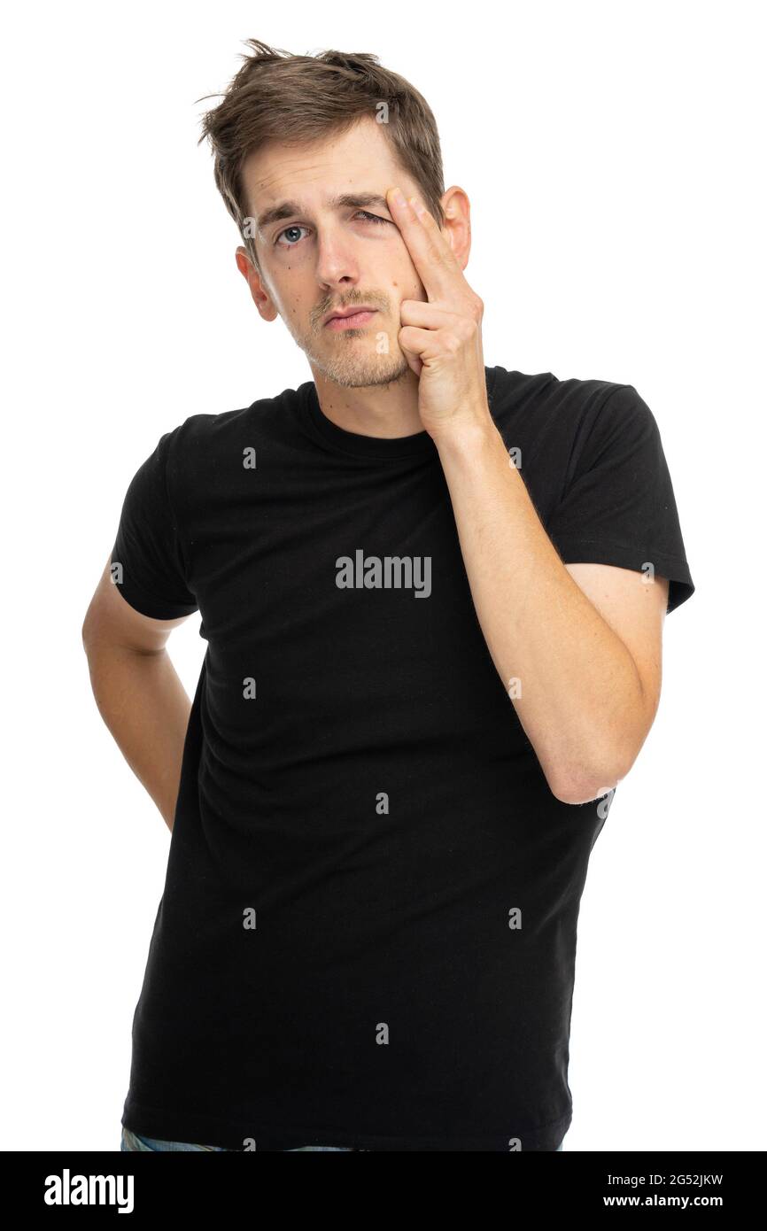 Young handsome tall slim white man with brown hair crumpling his face ...