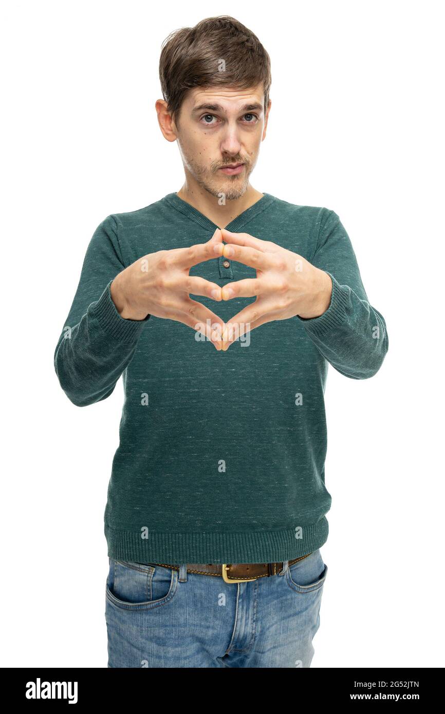 Young handsome tall slim white man with brown hair with joined fingers ...