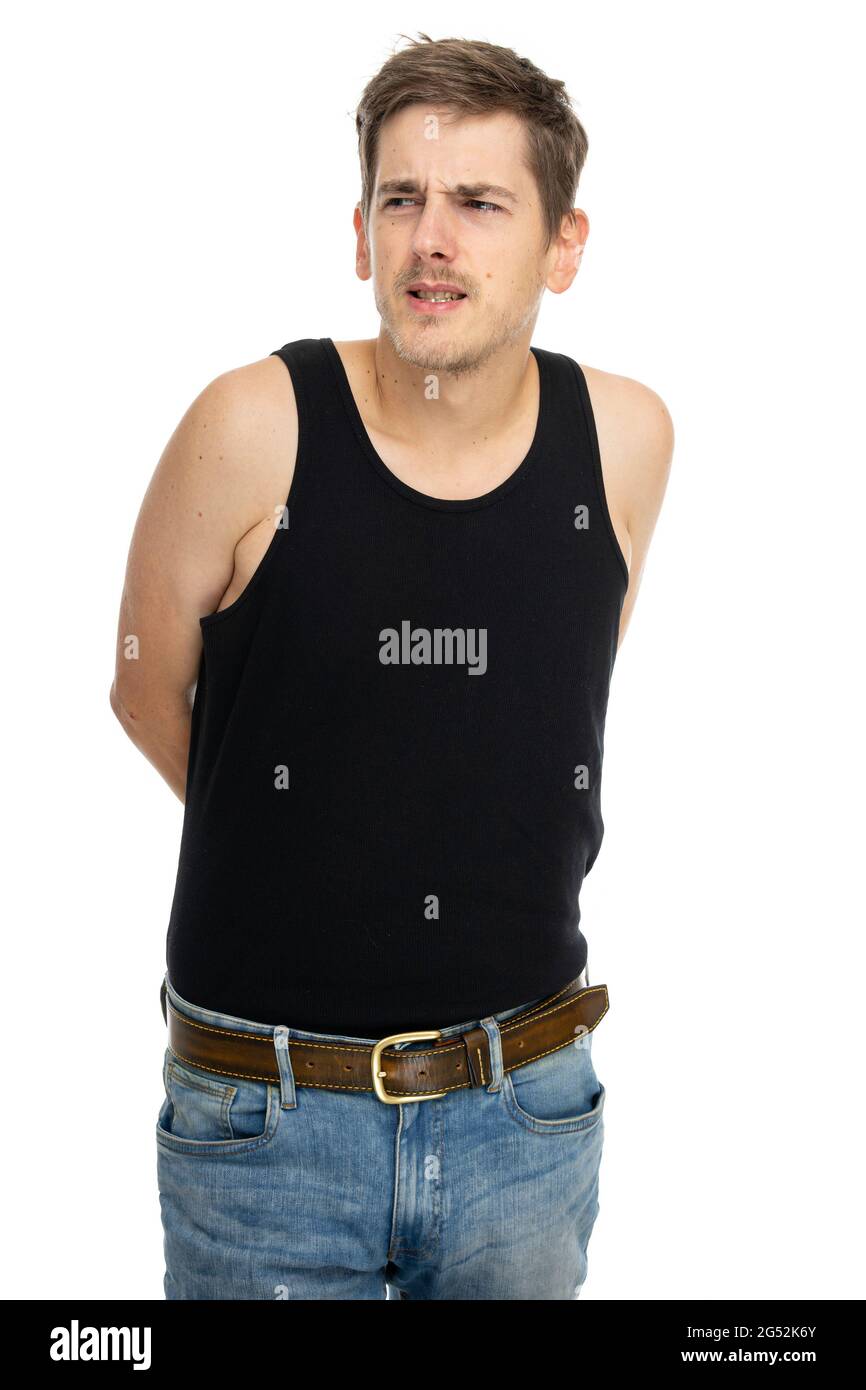 Young handsome tall slim white man with brown hair looking grumpy in ...