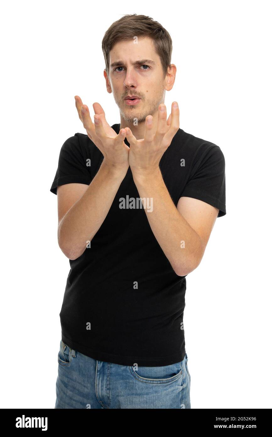 Young handsome tall slim white man with brown hair with joined arms and ...