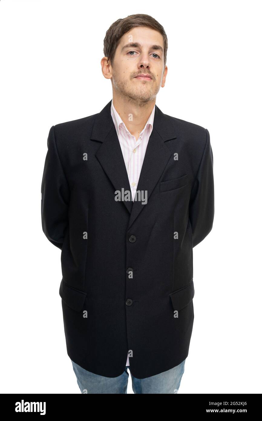 Young handsome tall slim white man with brown hair looks haughty in ...