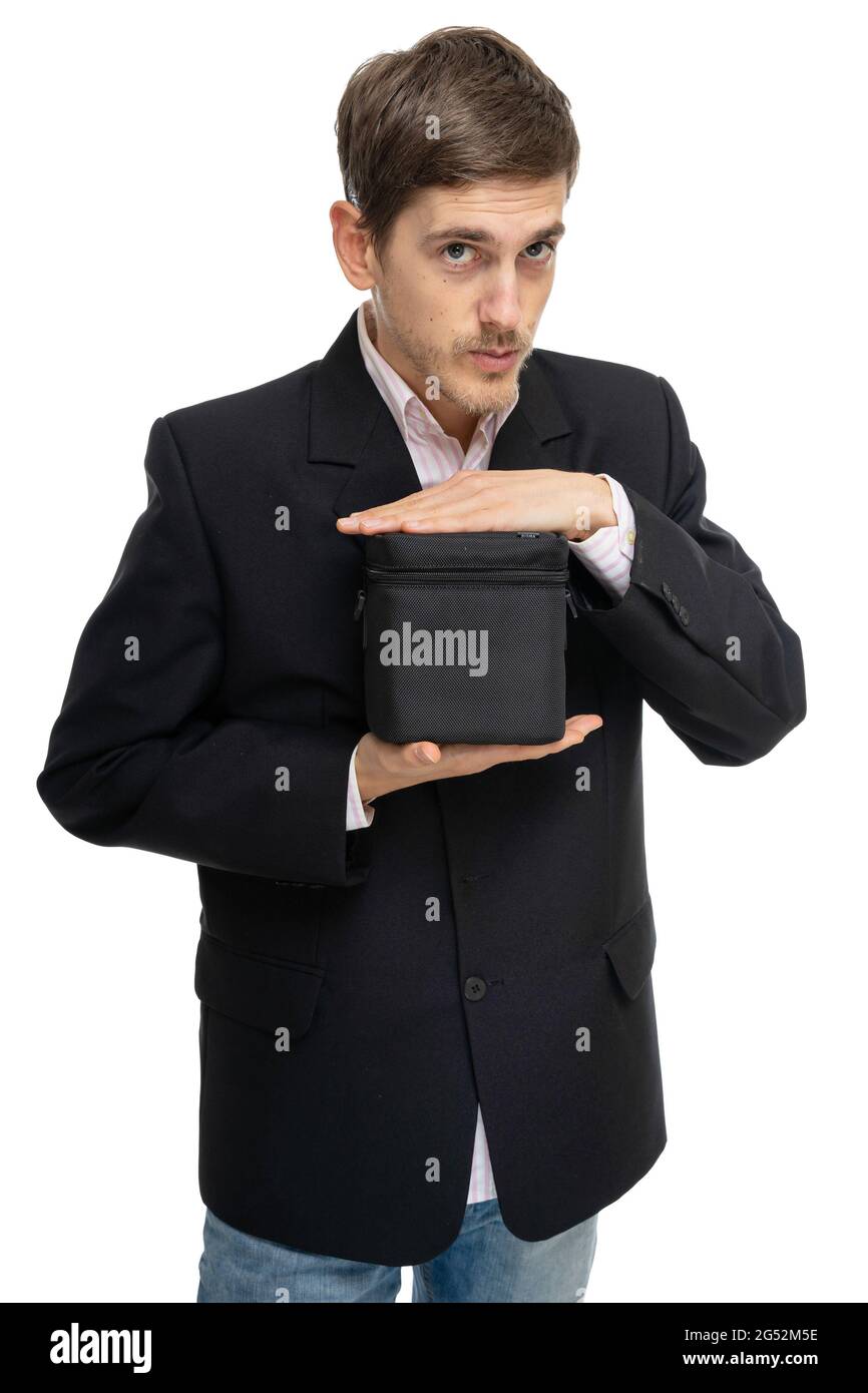 Young handsome tall slim white man with brown hair holding small black ...