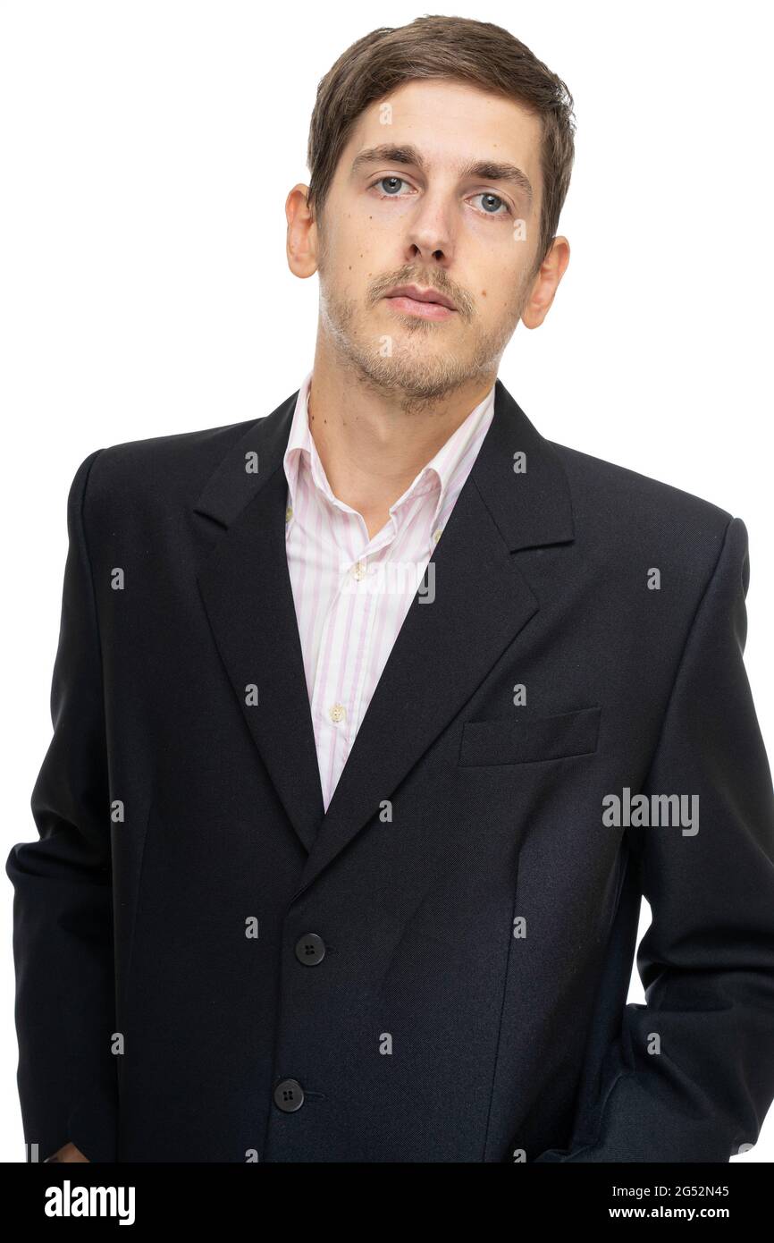 Young handsome tall slim white man with brown hair looks haughty in ...