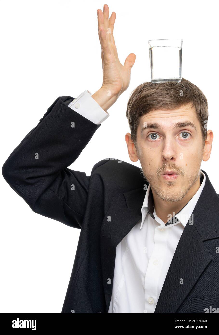 Young handsome tall slim white man with brown hair with glass of water ...