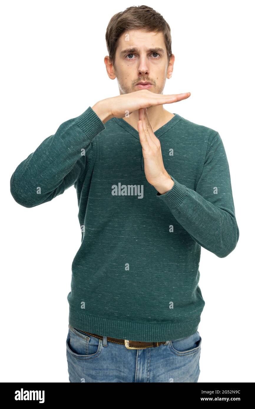 Young handsome tall slim white man with brown hair making letter t with ...