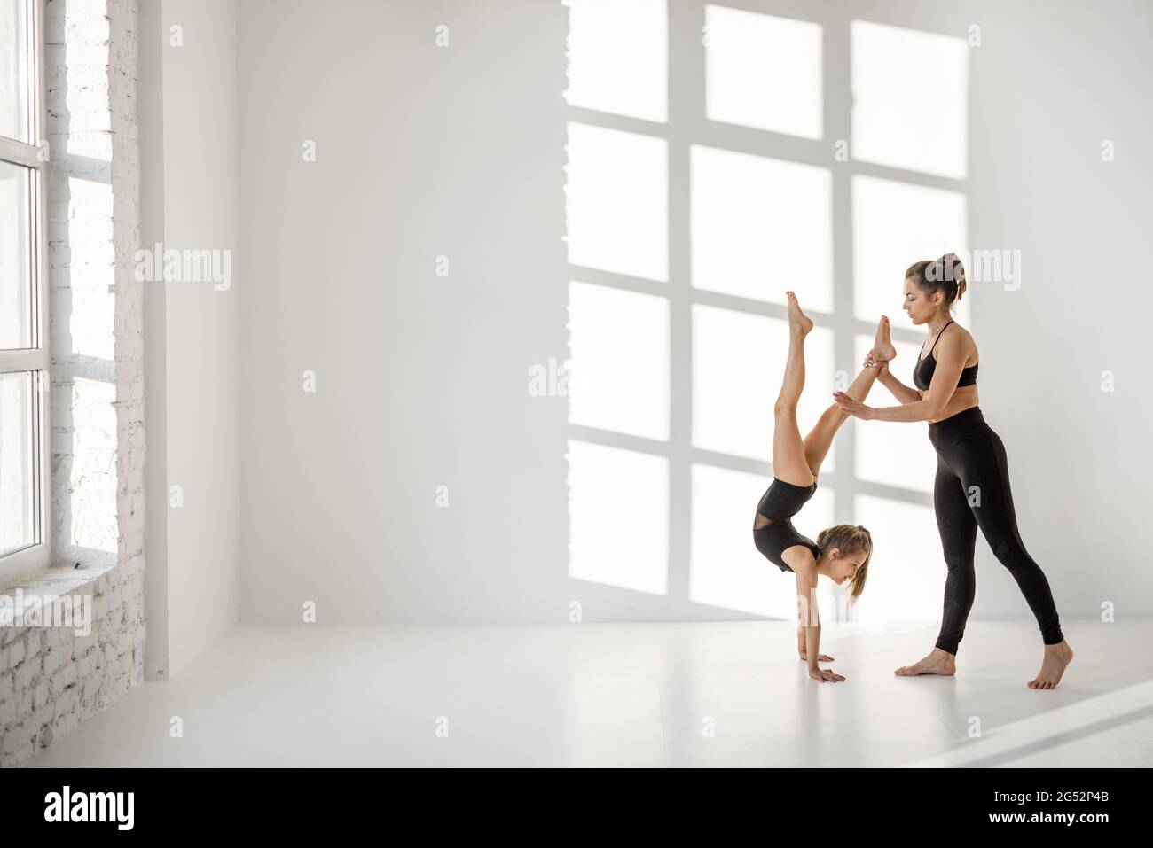Woman with a little girl on rhythmic gymnastics training Stock Photo ...