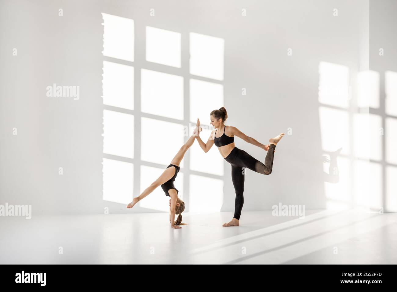 Woman with a little girl on rhythmic gymnastics training Stock Photo ...
